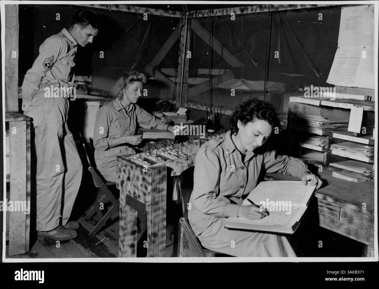 Lt. Helen Krieg (center), nurse in charge, discusses a case with S. Sgt ...
