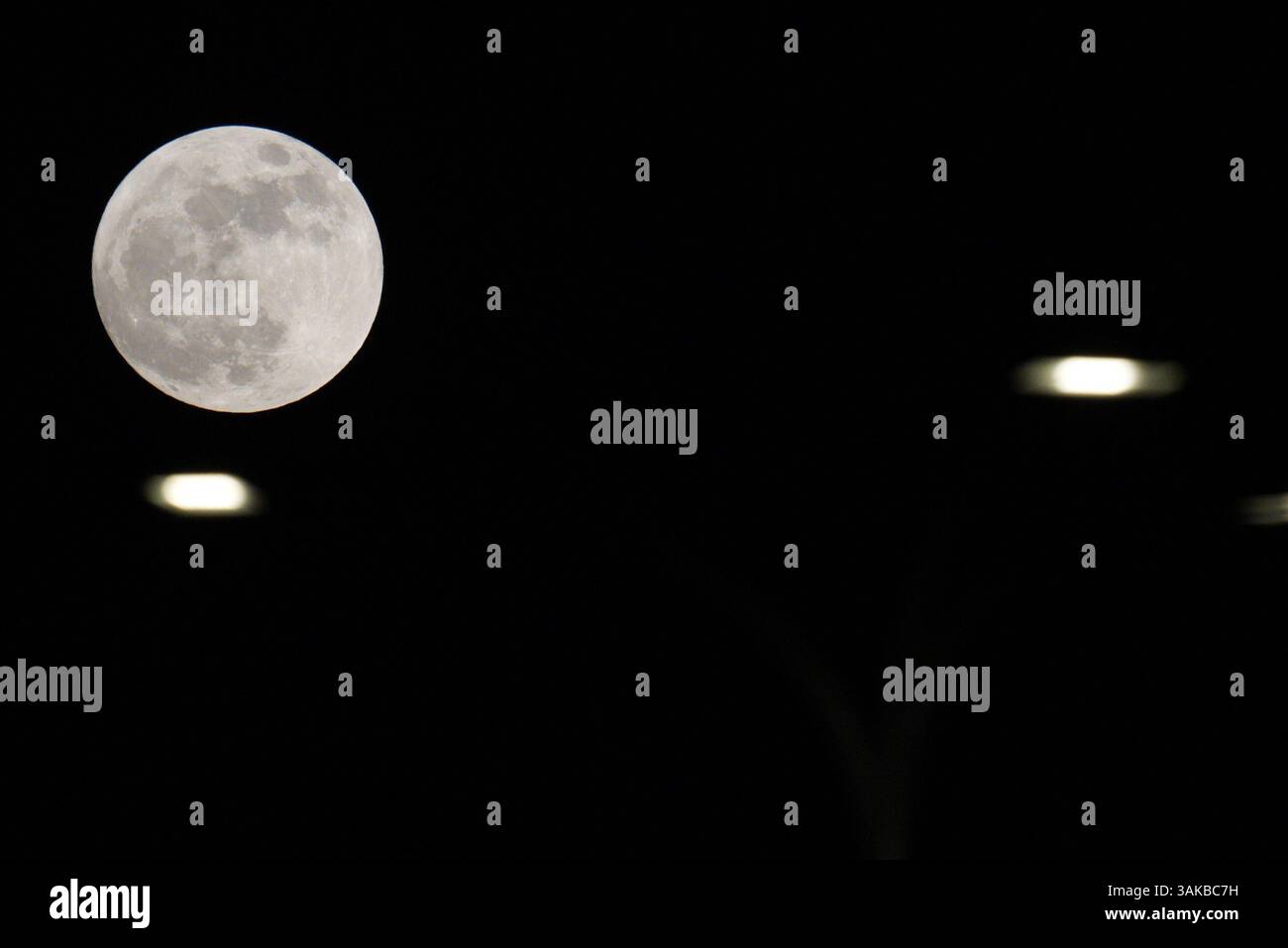 Warsaw, Poland. 12th Apr, 2025. The full moon called the pink moon is ...