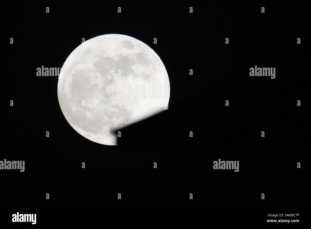 Warsaw, Poland. 12th Apr, 2025. The full moon called the pink moon is ...