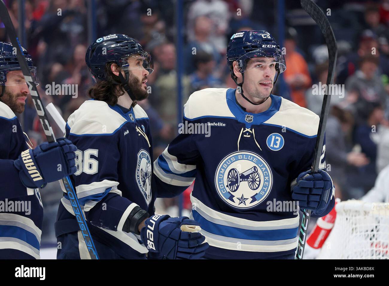 Columbus Blue Jackets center Sean Monahan, right, celebrates his goal ...