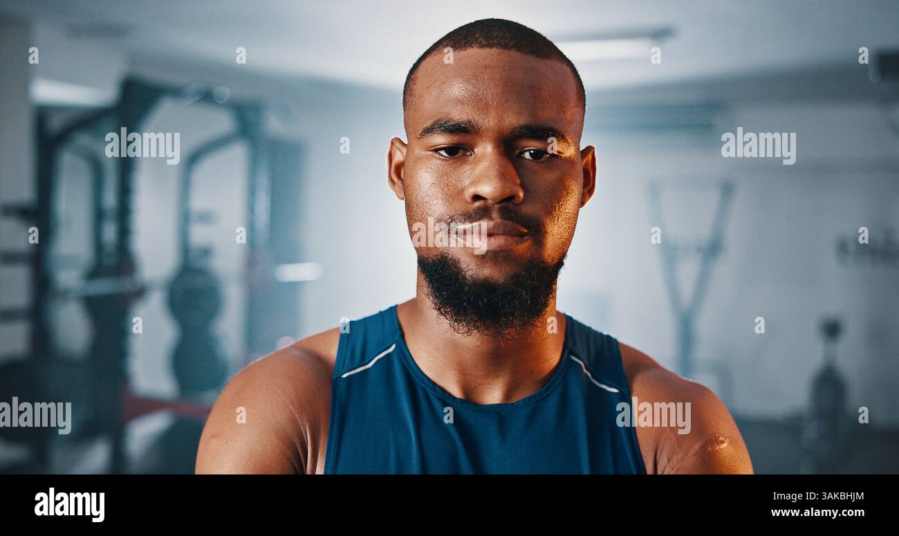 Portrait, fitness and serious black man in gym for exercise, muscle and strength training for ...