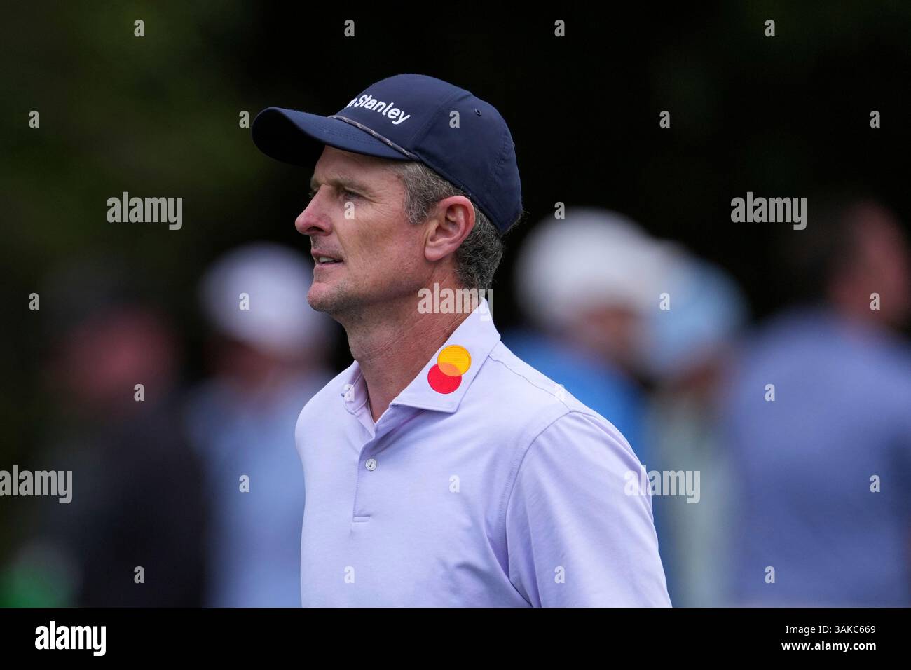 Justin Rose walks to the green on the first hole during the third round ...