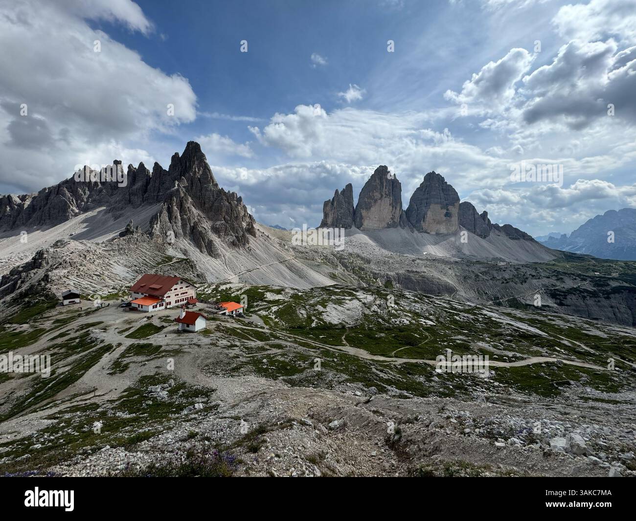 Famous mountain range Tre Cime di Lavaredo with surrounding peak monte ...
