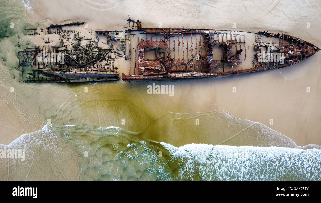 A washed up shipwreck on a sandy beach, photograped with a drone Stock ...