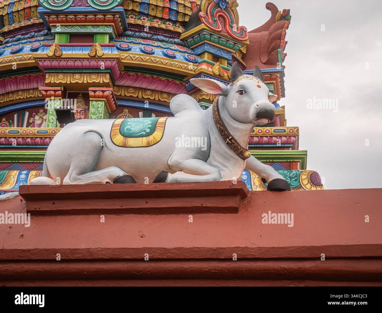 Cow Statue Adorning a Colorful Hindu Temple in Singapore Stock Photo ...