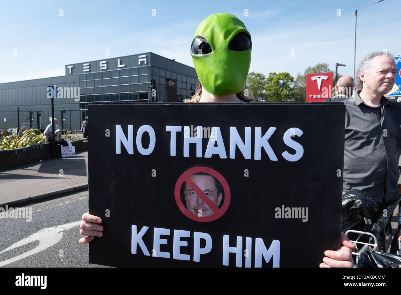 London, UK. 12 April, 2025. A woman wears a green alien mask while ...