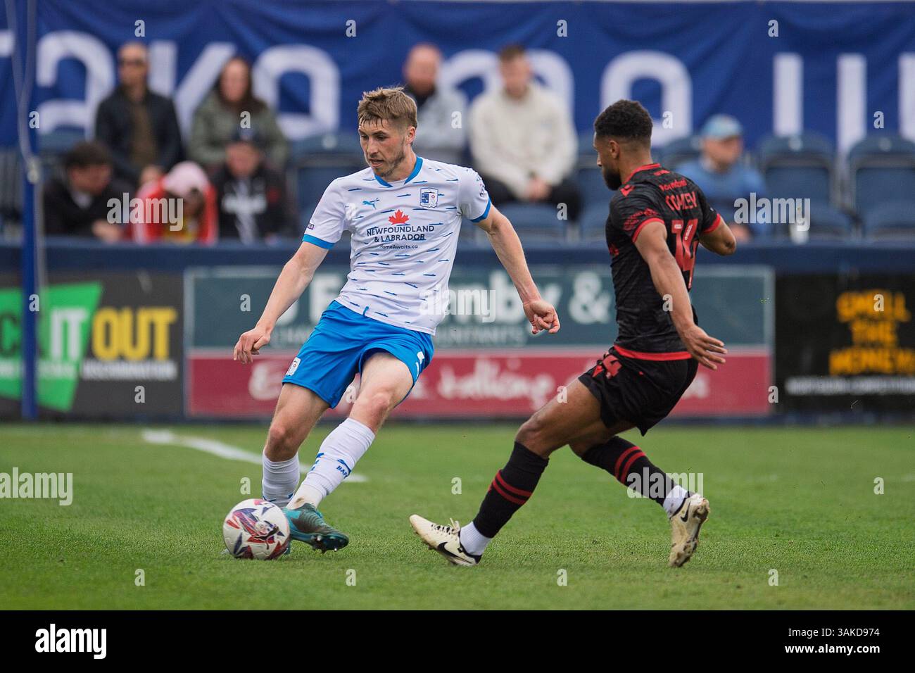 Barrow's Dean Campbell in action with Walsall's Brandon Comley during ...
