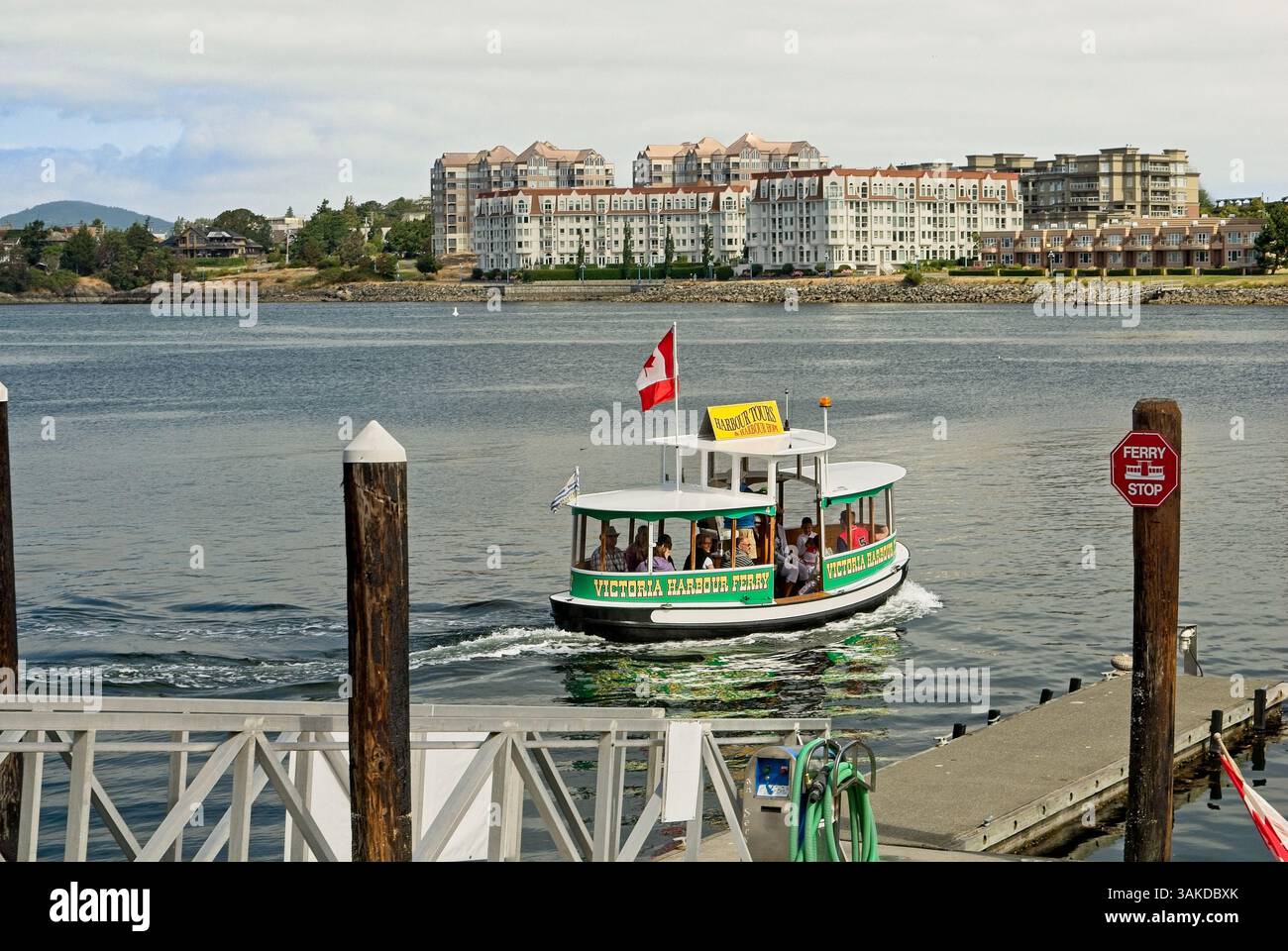 Famous Victoria harbor water taxi sets off from ferry stop in Port of ...