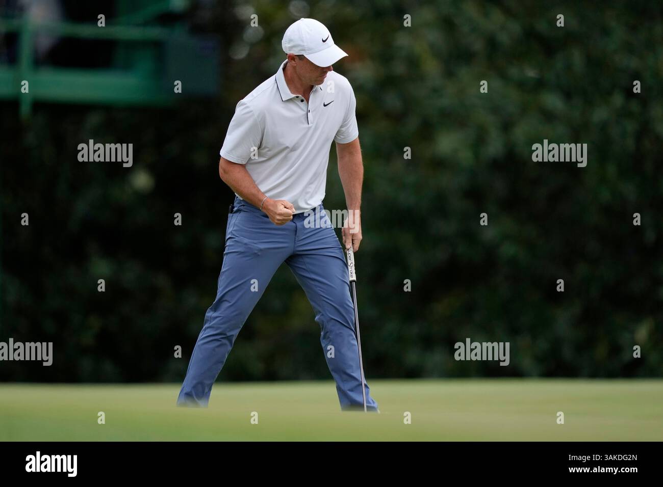Rory McIlroy, of Northern Ireland, celebrates after making a putt on ...