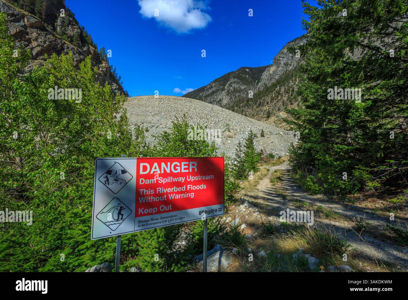 A warning sign below the Terzaghi Dam at Carpenter Lake Stock Photo - Alamy