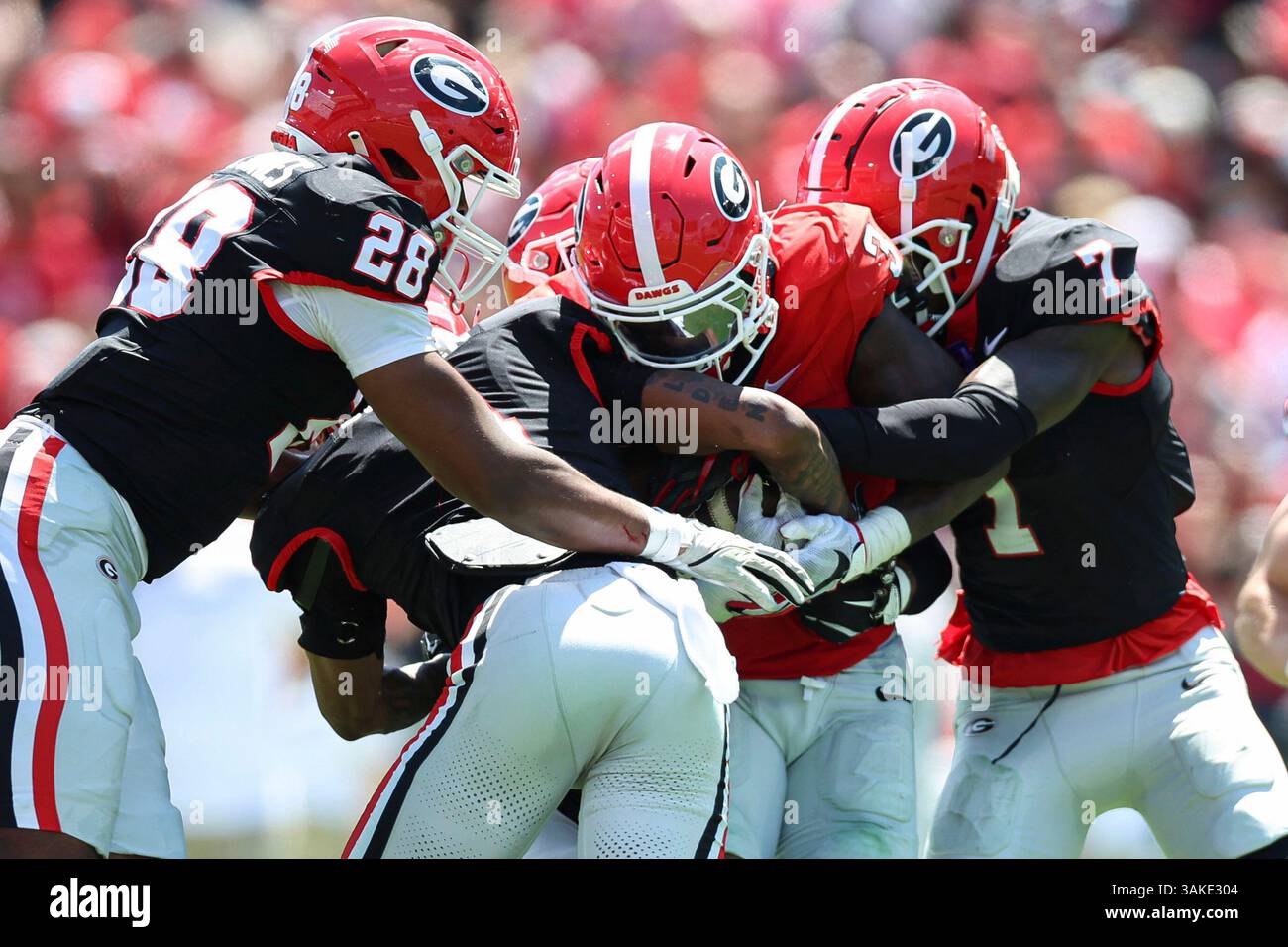 Georgia Red Team running back Nate Frazier (3) gets tackled during the ...