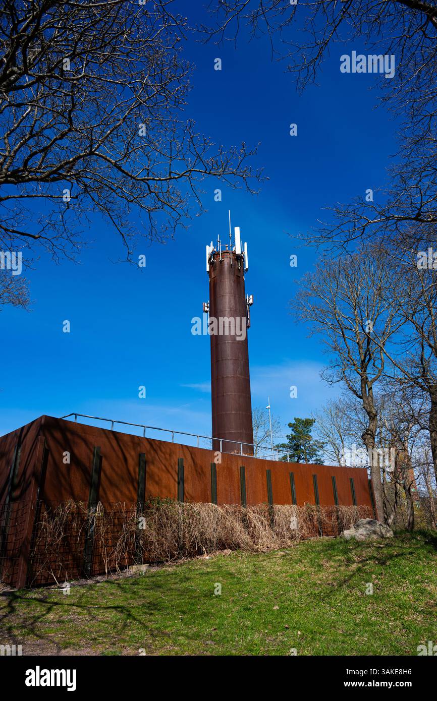 Mobile telephone base tower and district heating funnel Stock Photo - Alamy