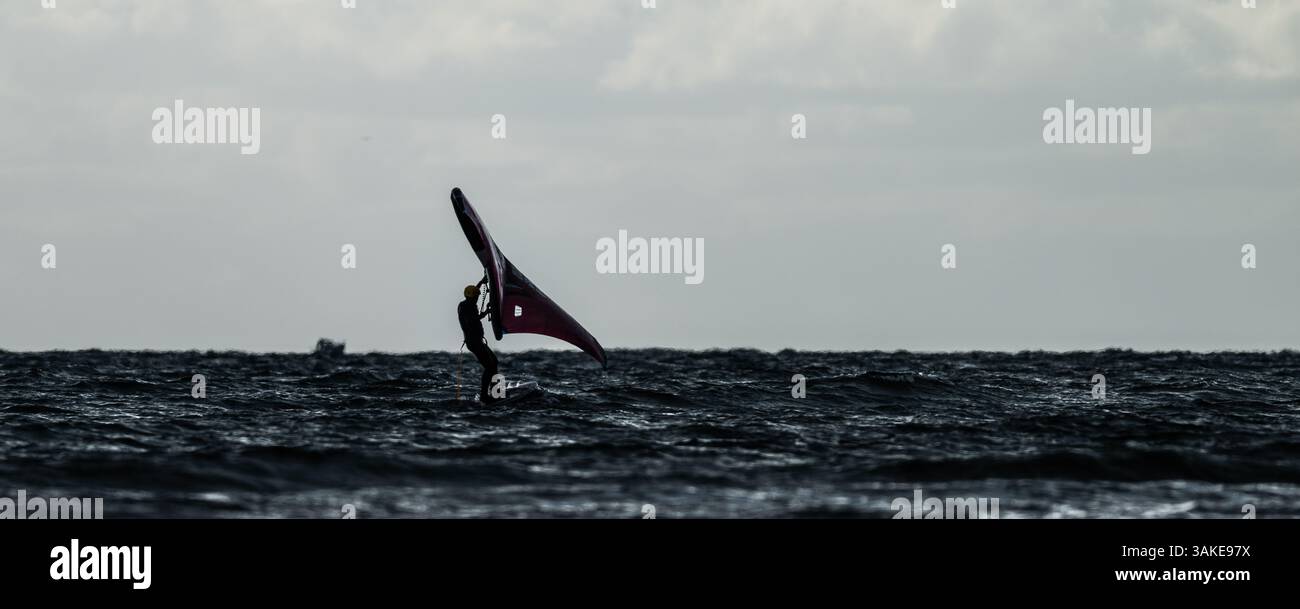 Person wing foiling on a windy day Stock Photo - Alamy