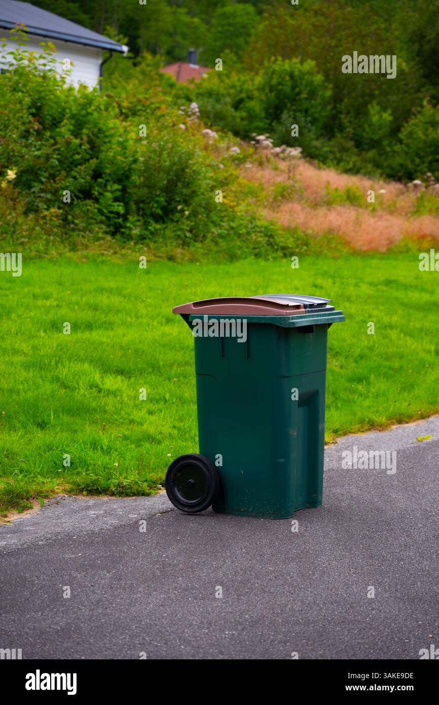 Green trash can with two separate chambers Stock Photo - Alamy