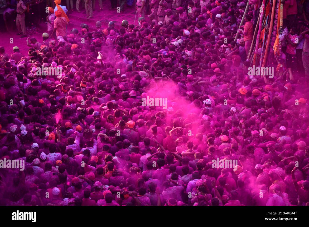 People throw Gulal a red color powder at the Palkhi (Planquin) of ...