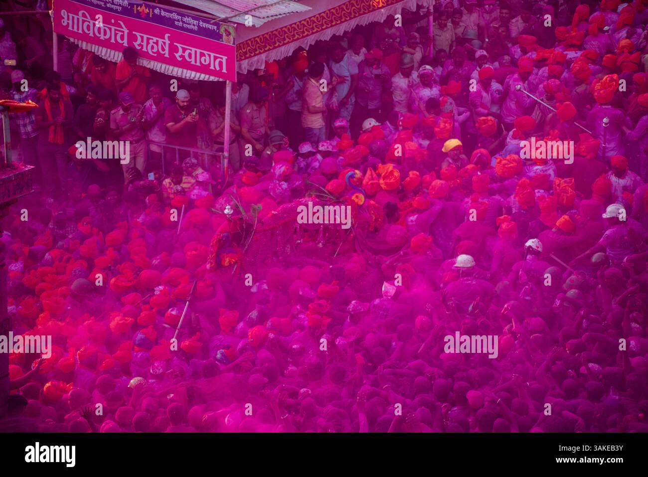 People throw Gulal a red color powder at the Palkhi (Planquin) of ...