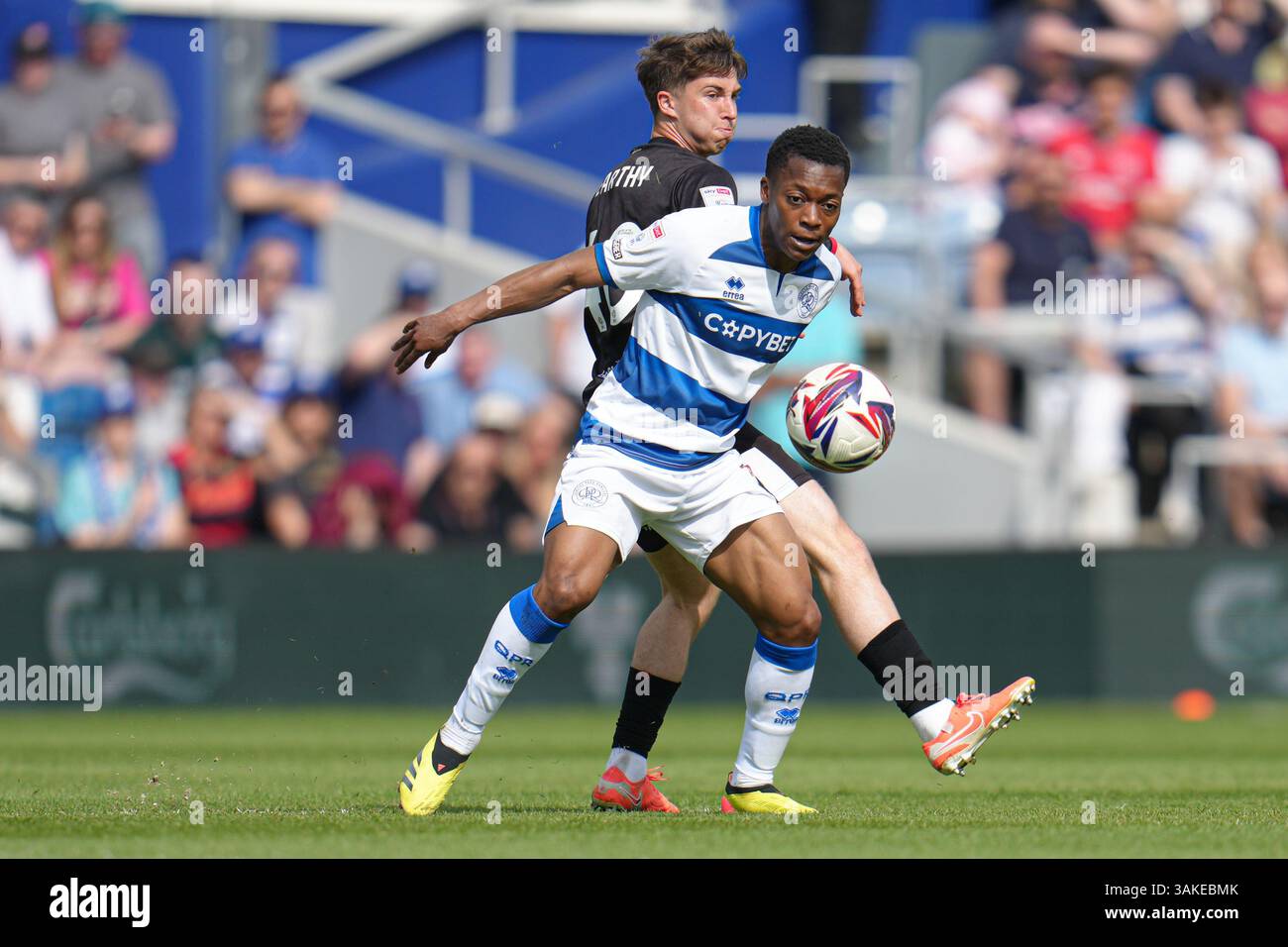 Karamoko Dembélé of Queens Park Rangers and George Earthy of Bristol ...