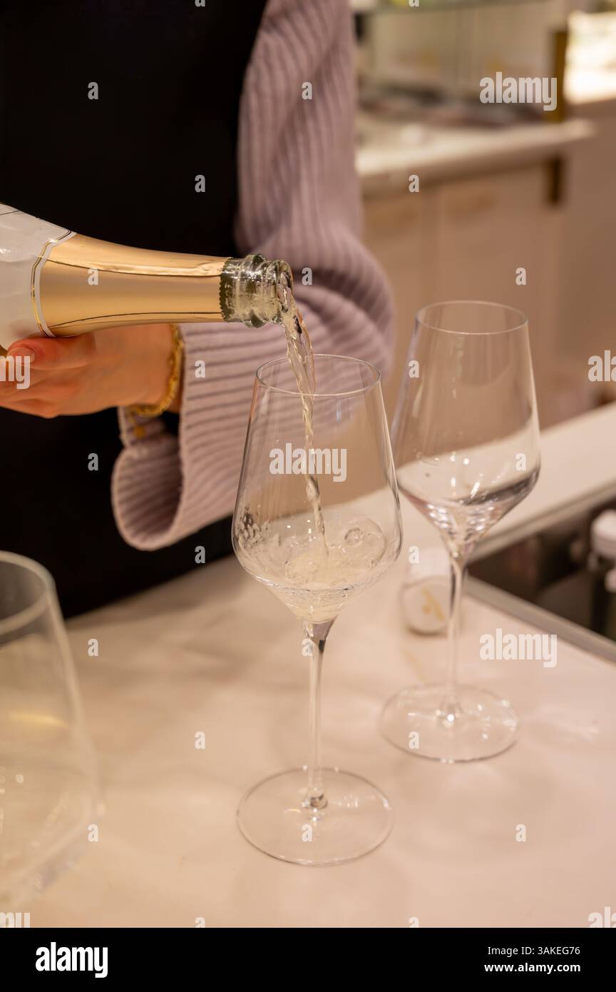 Tasting of brut champagne sparkling wine produced by traditional method in underground caves ...