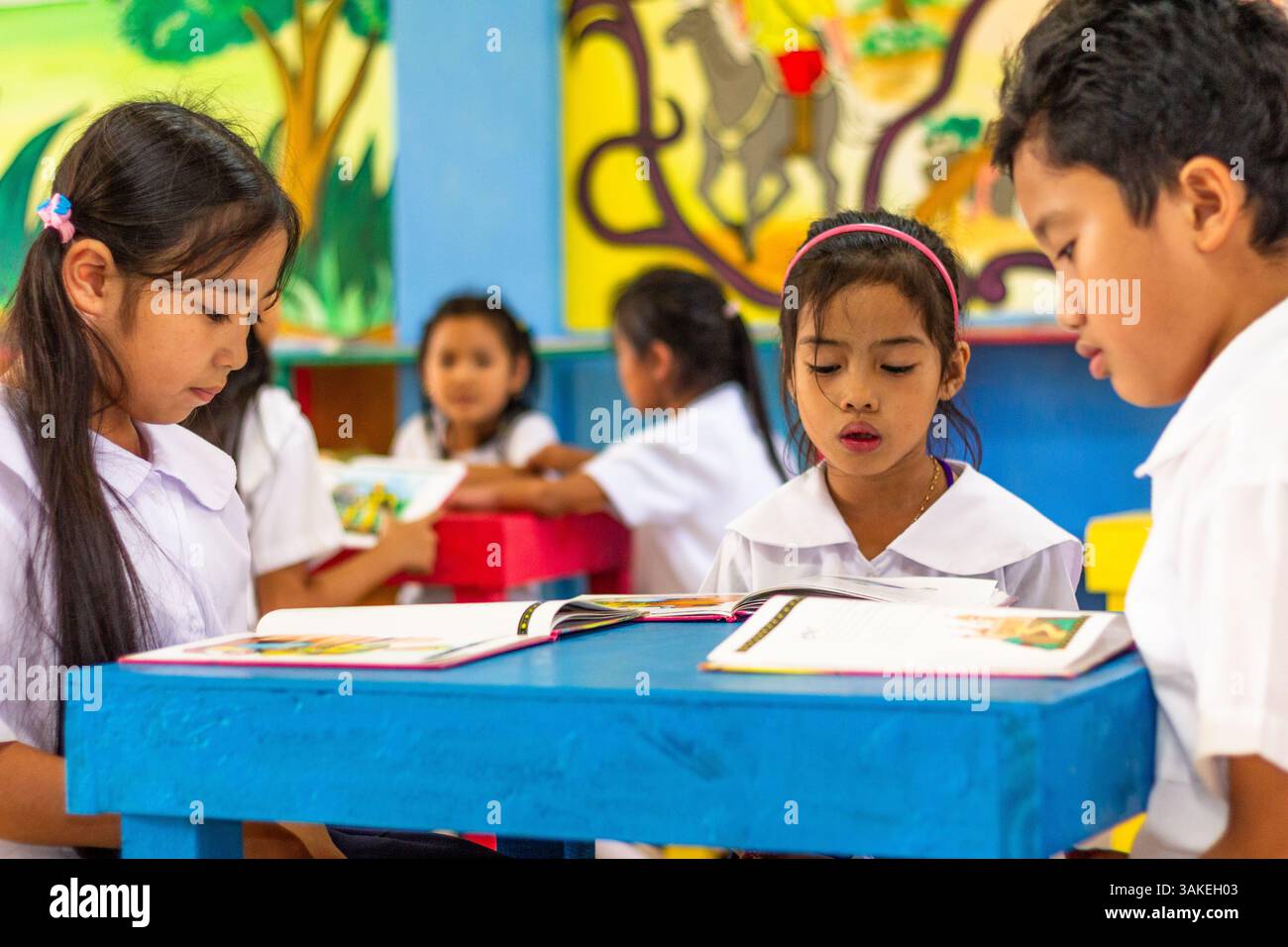 Filipino students enjoy reading time at a public elementary school ...