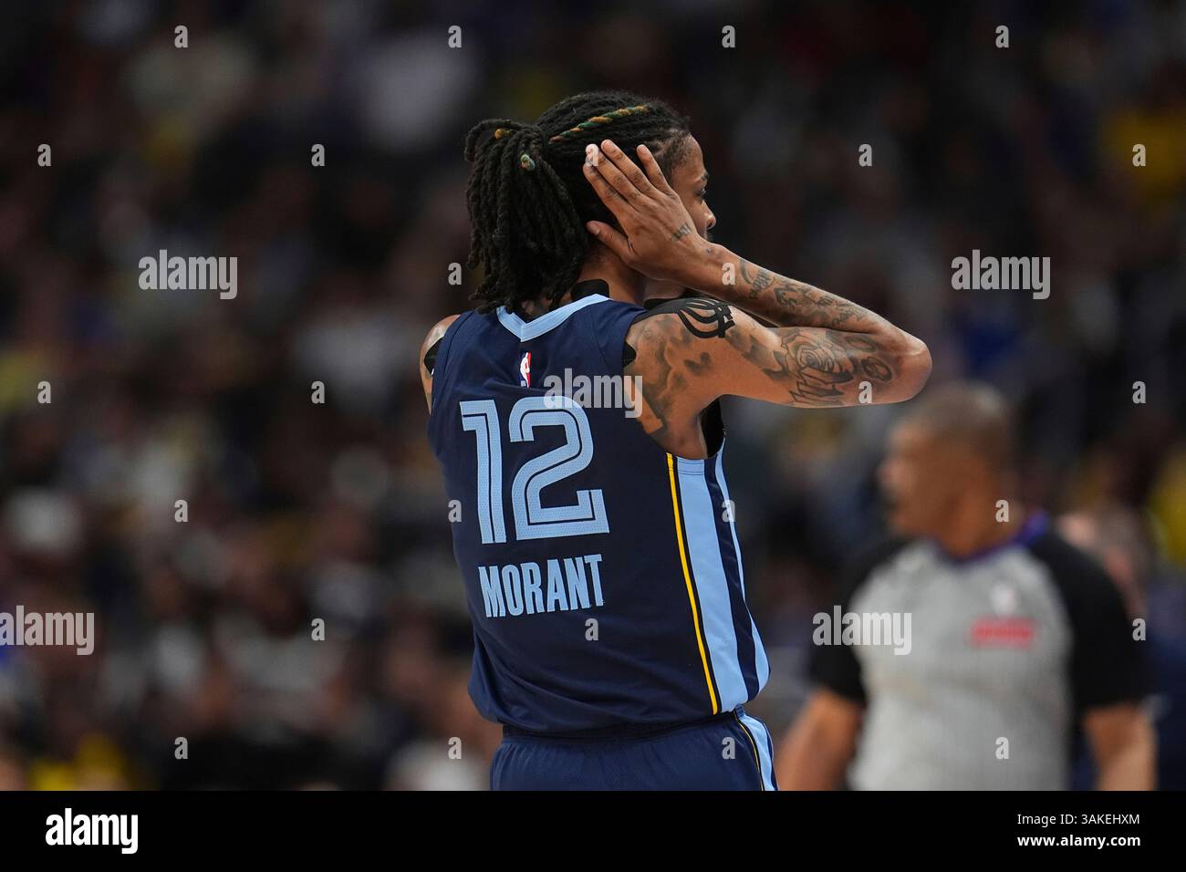 Memphis Grizzlies guard Ja Morant (12) covers his ears after his ...
