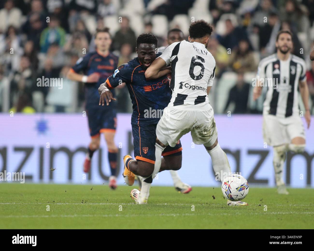 Turin, Italy. 12th Apr, 2025. Konan N'Dri of US Lecce and Lloyd Kelly ...