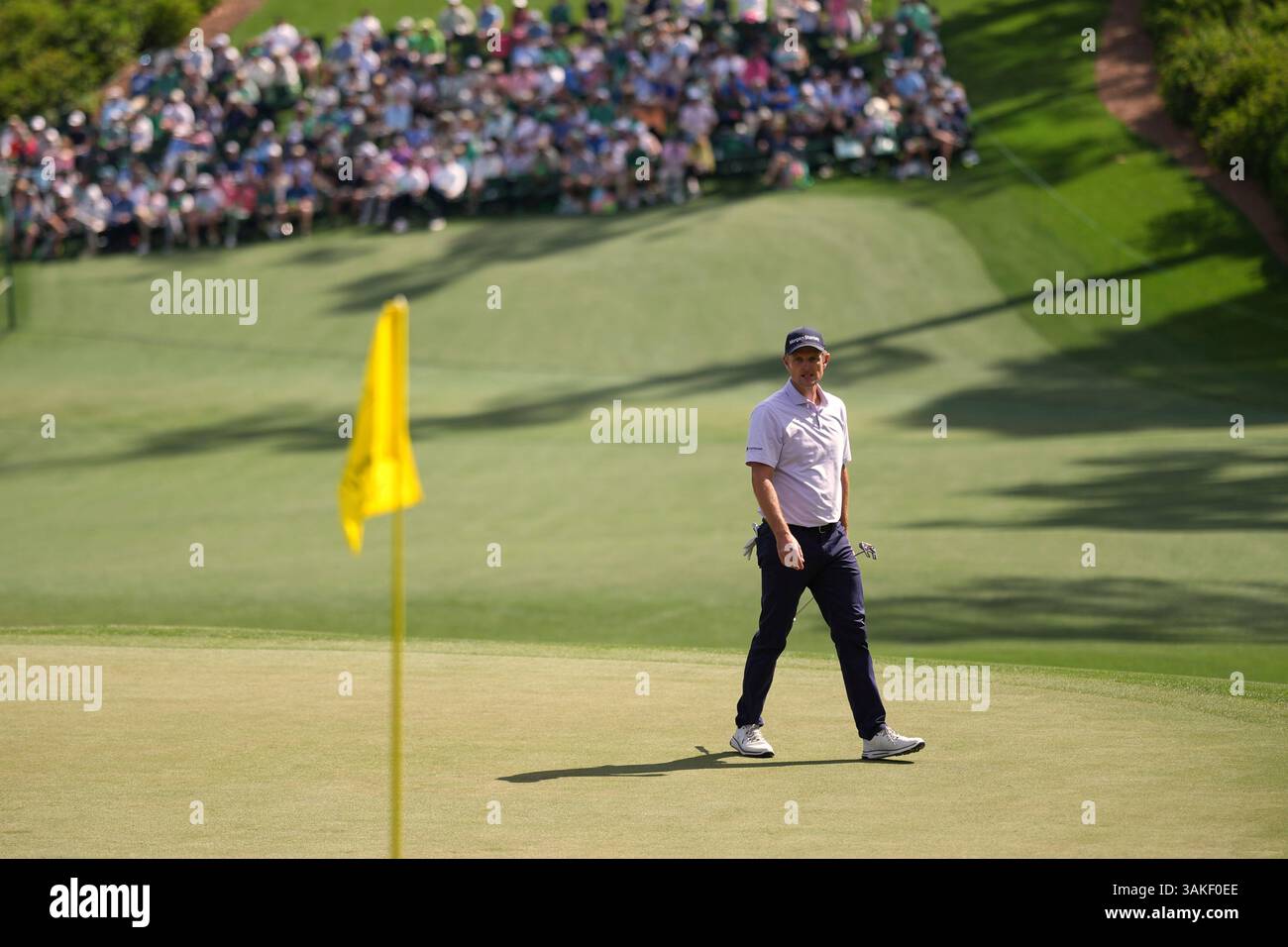 Justin Rose reacts after missing a putt on the sixth hole during the ...