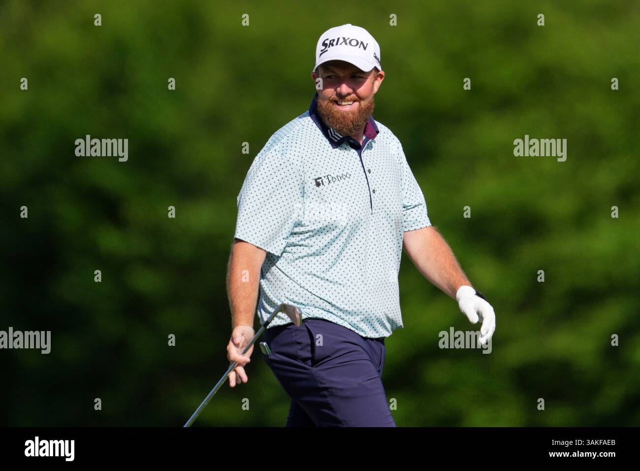 Shane Lowry, of Ireland, smiles on the 12th hole during the third round ...