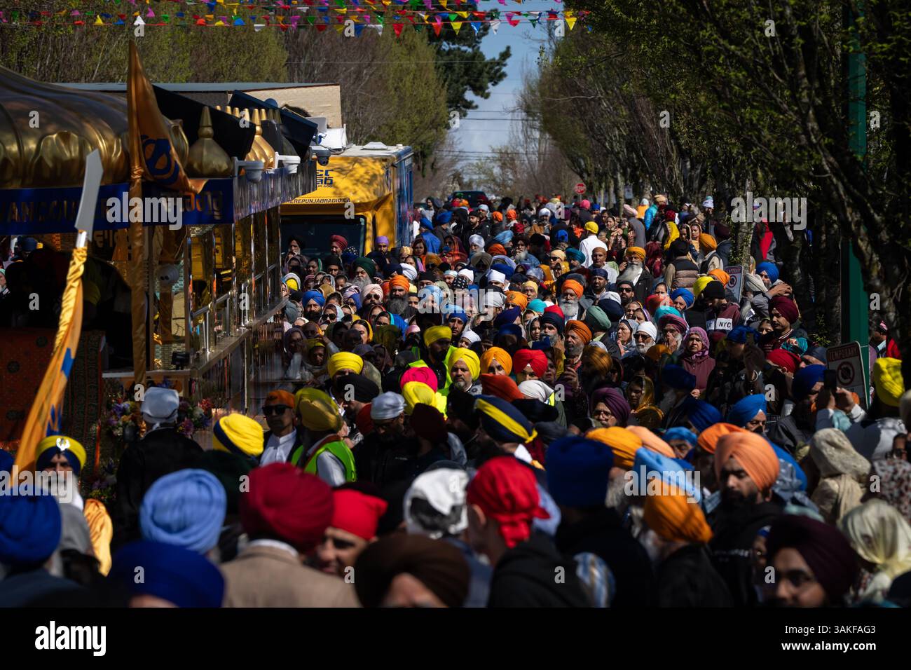 People gather around the main float during the Vaisakhi parade in ...