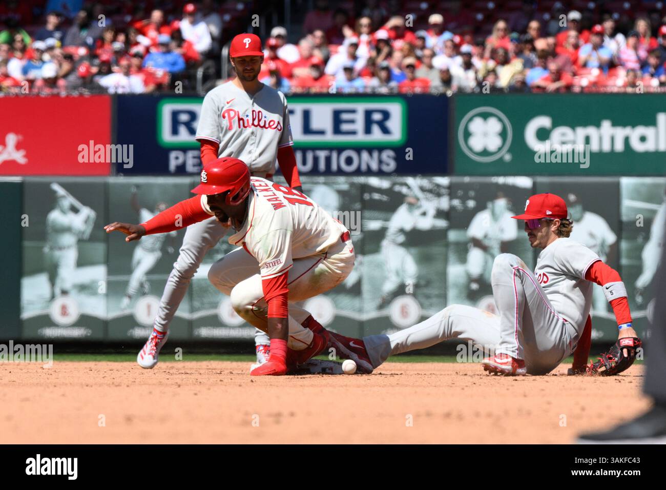 St. Louis Cardinals' Jordan Walker, bottom left, is safe at second on ...