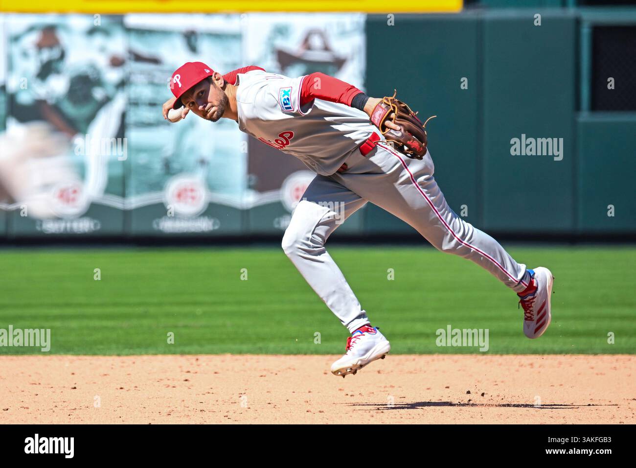 ST. LOUIS, MO - APR 12: Philadelphia Phillies shortstop Trea Turner (7) throws off balance over ...
