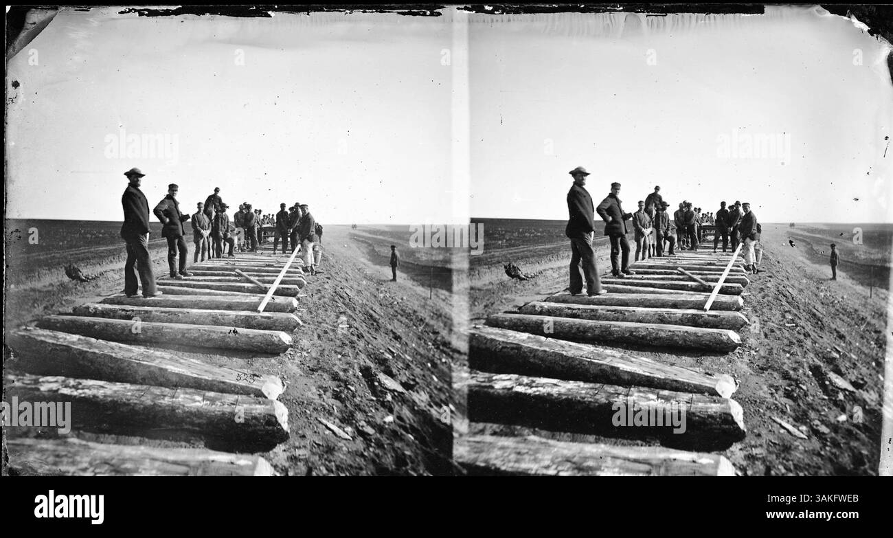 This photograph depicts Northern Pacific Railroad workers laying track ...
