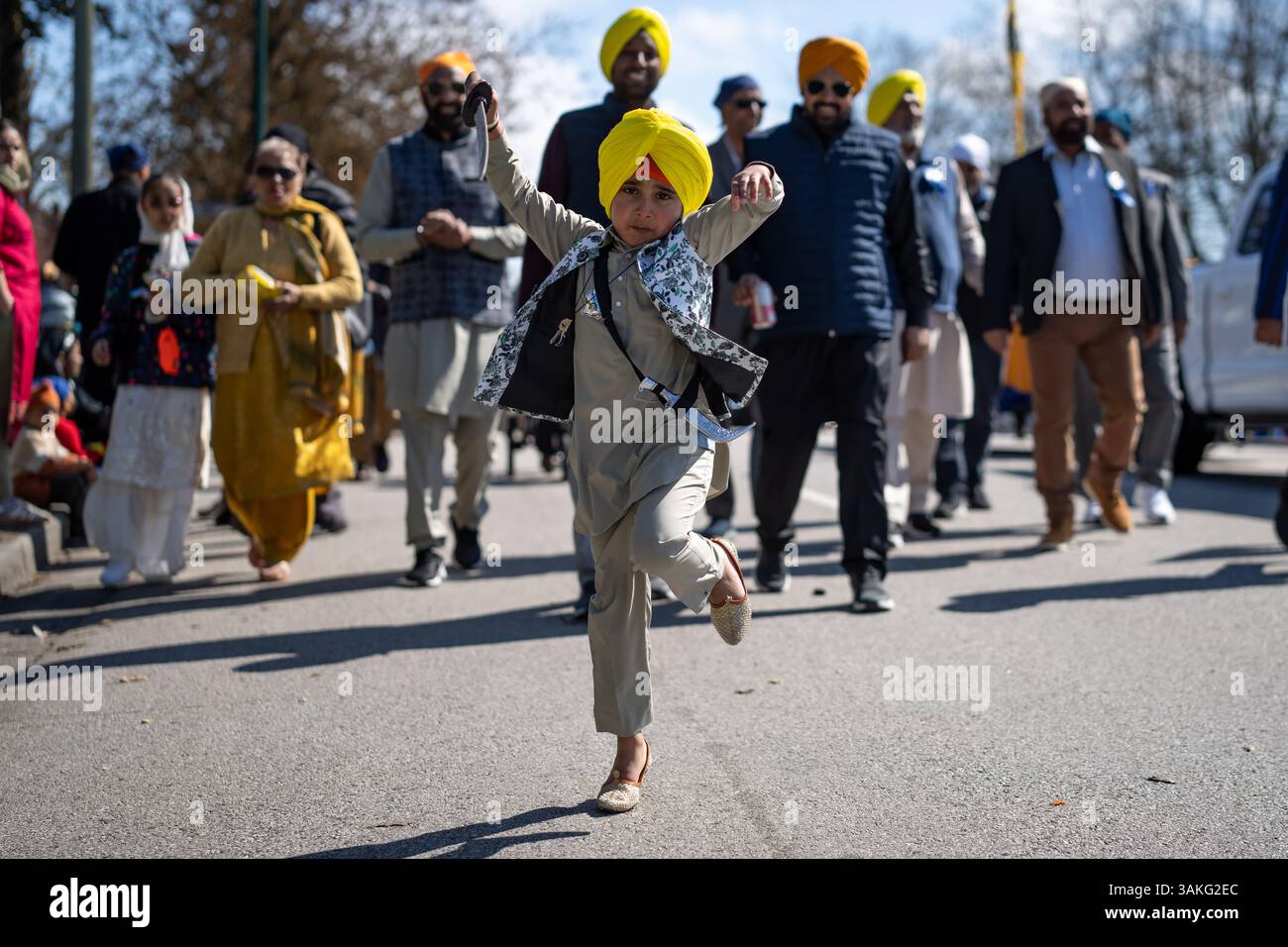 A boy walks with a sword during the Vaisakhi parade in Vancouver, B.C ...
