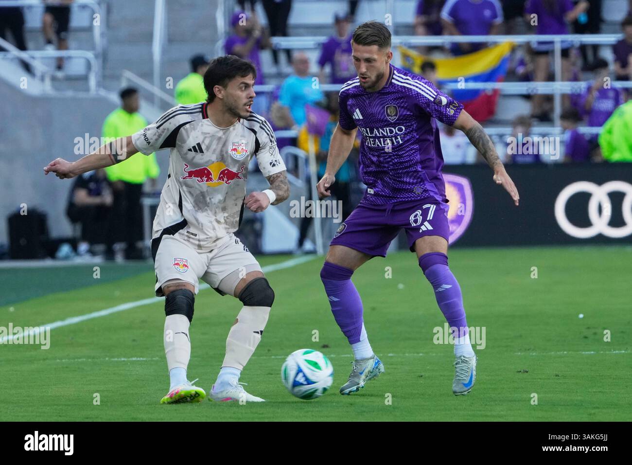 New York Red Bulls midfielder Felipe Carballo, left, looks to pass the ...