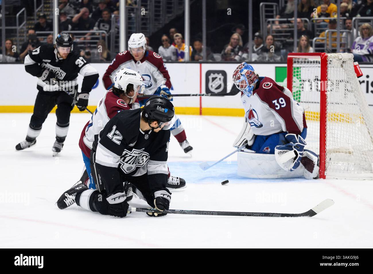 Los Angeles Kings left wing Trevor Moore (12) watches his shot during ...