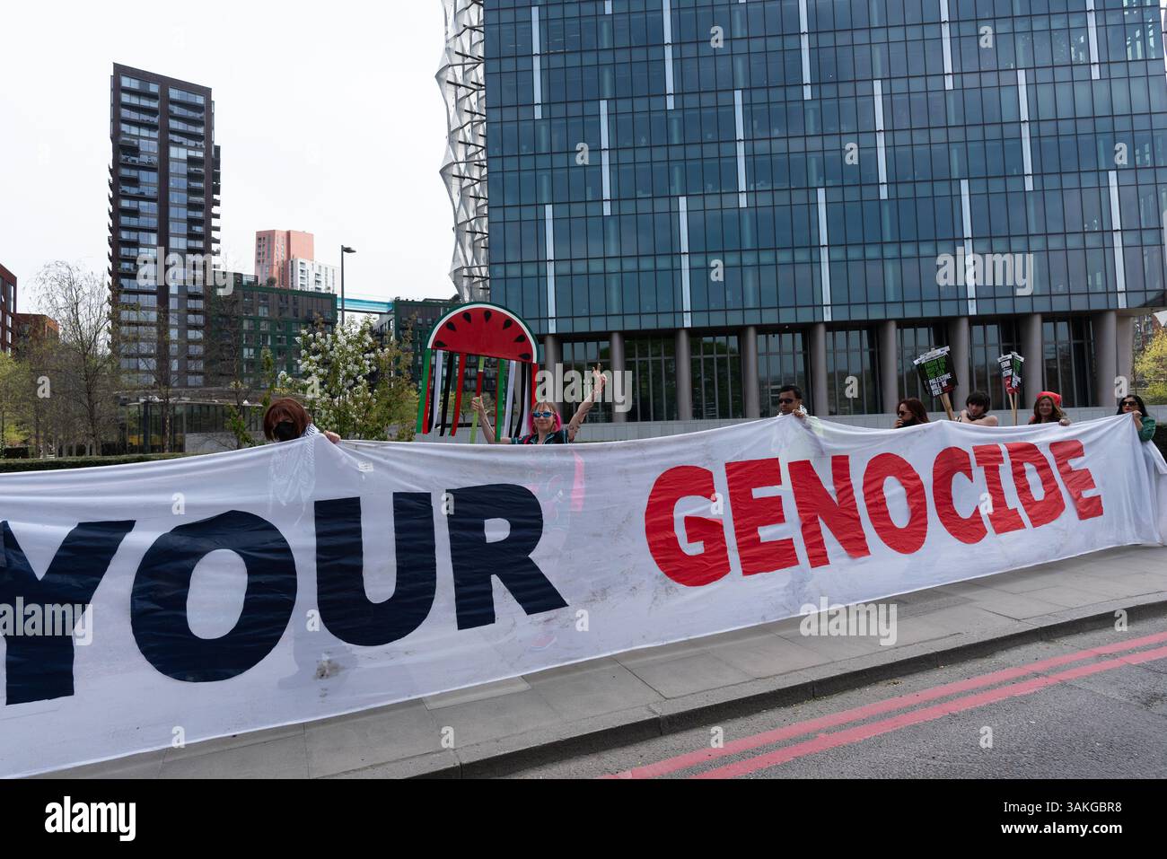 London, UK. 12 April, 2025. A large banner declaring "Your Genocide" is ...