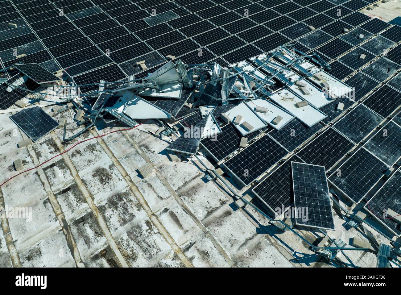 Aerial view of damaged by hurricane wind photovoltaic solar panels ...