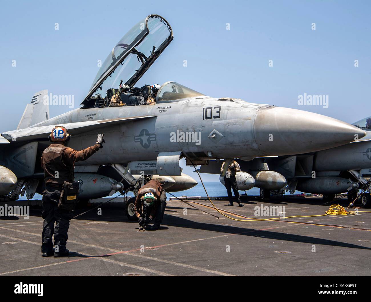 Red Sea, United States. 11 April, 2025. A U.S. Navy sailors run a F/A ...