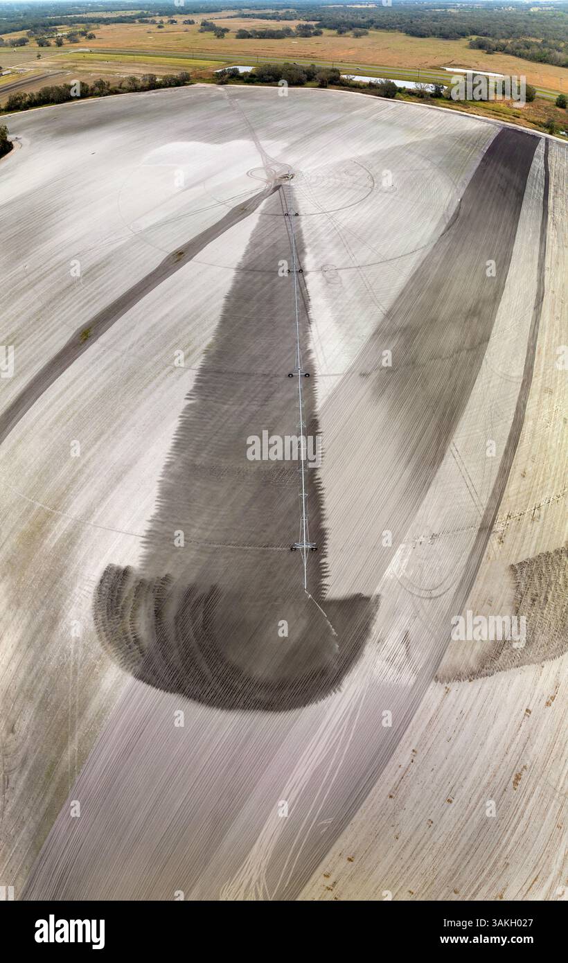 Irrigation system watering farm field during drought season. Industrial ...