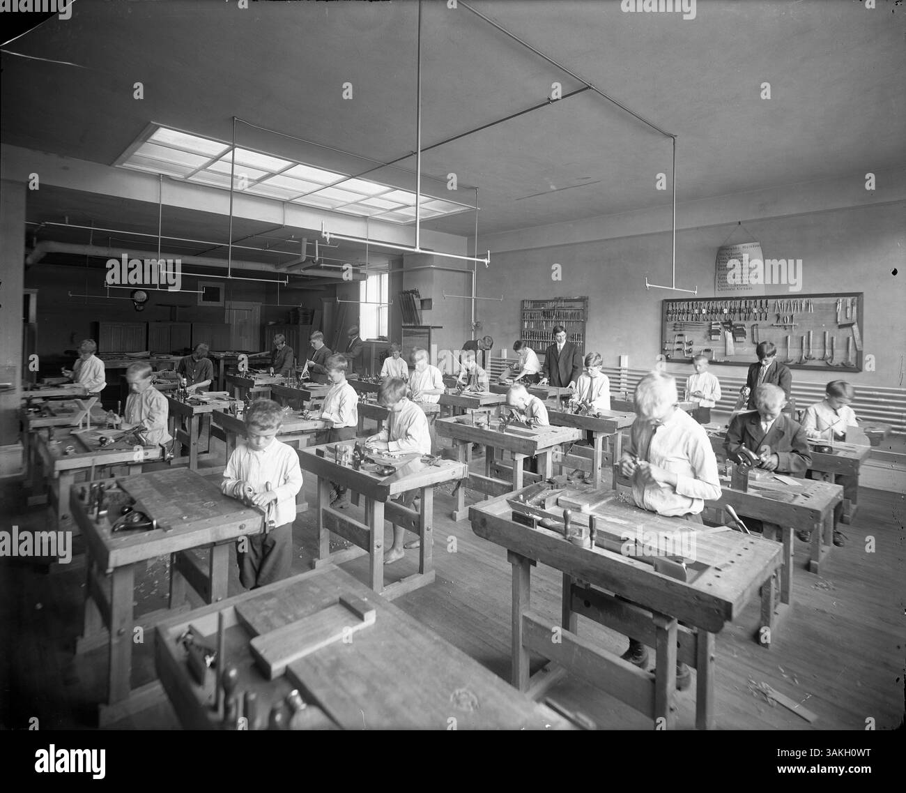 Boys are shown in a woodworking class at Irving School, showcasing ...