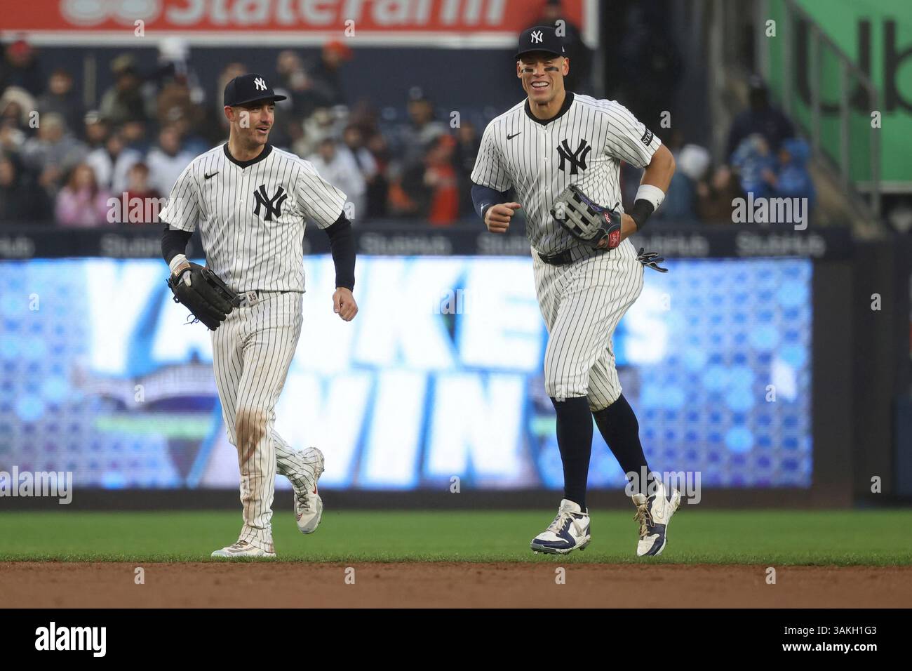 New York Yankees' Cody Bellinger, left, and Aaron Judge, right, react ...