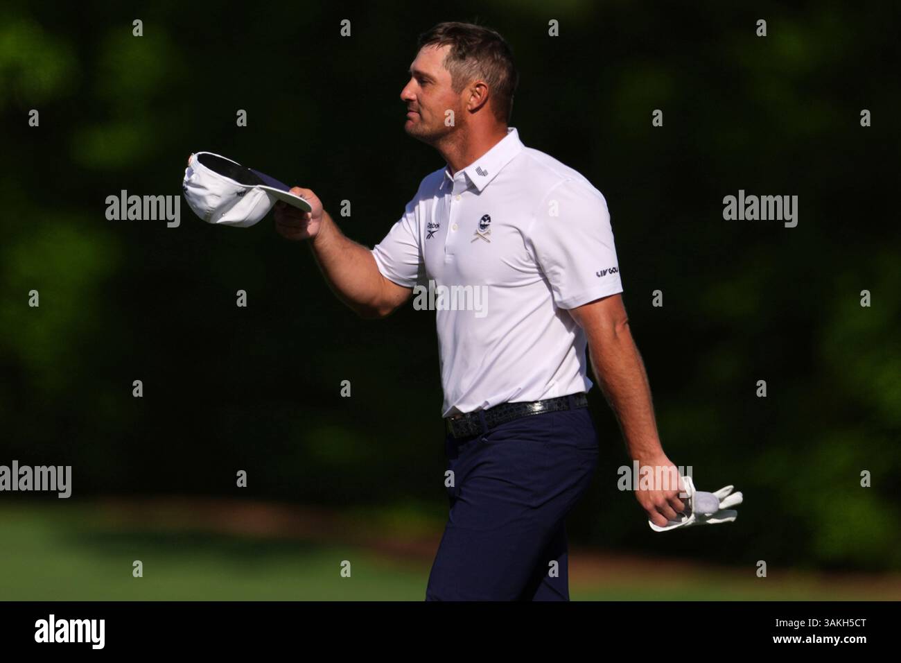 Bryson DeChambeau walks to the tee on the 12th hole during the third ...