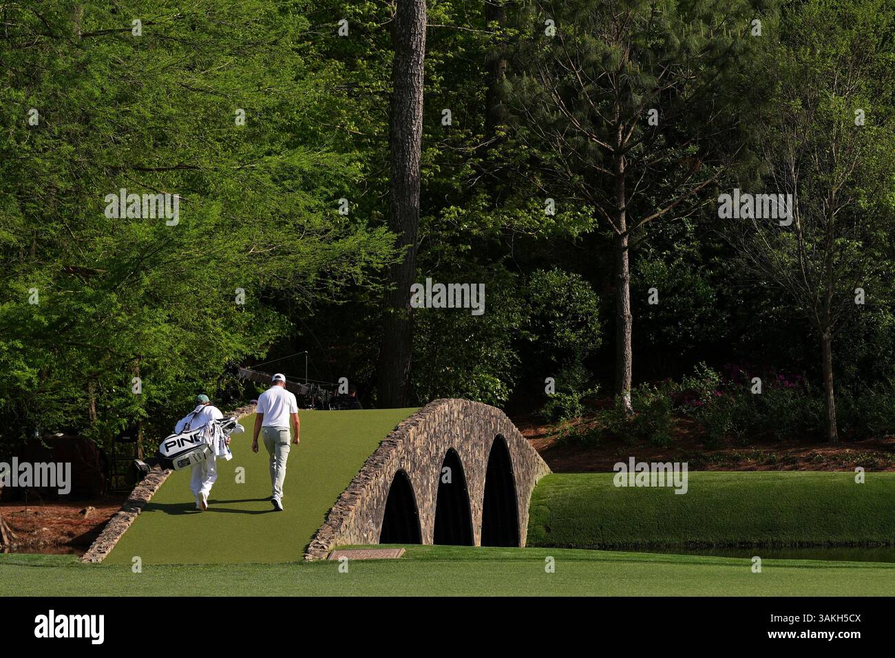 Corey Conners, of Canada, walks over the Ben Hogan Bridge on the 12th ...