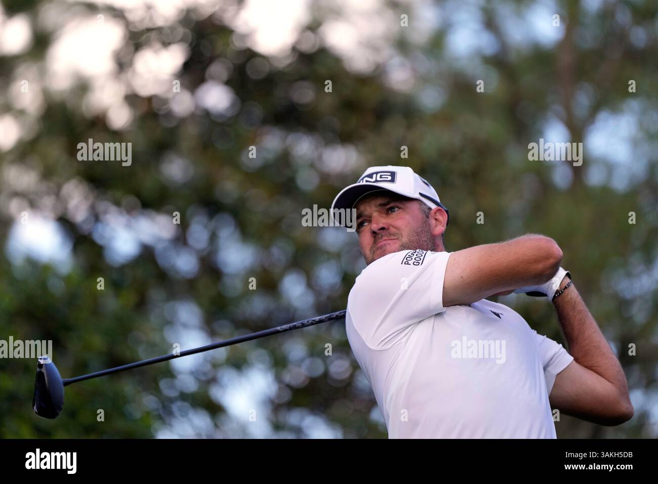 Corey Conners, of Canada, watches his tee shot on the 15th hole during ...