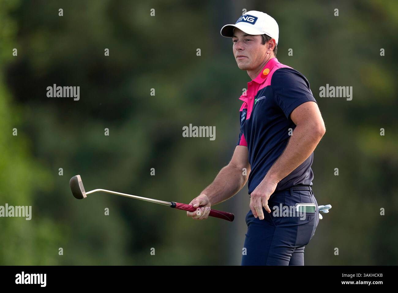 Viktor Hovland, of Norway, waves after making a putt on the 18th hole ...
