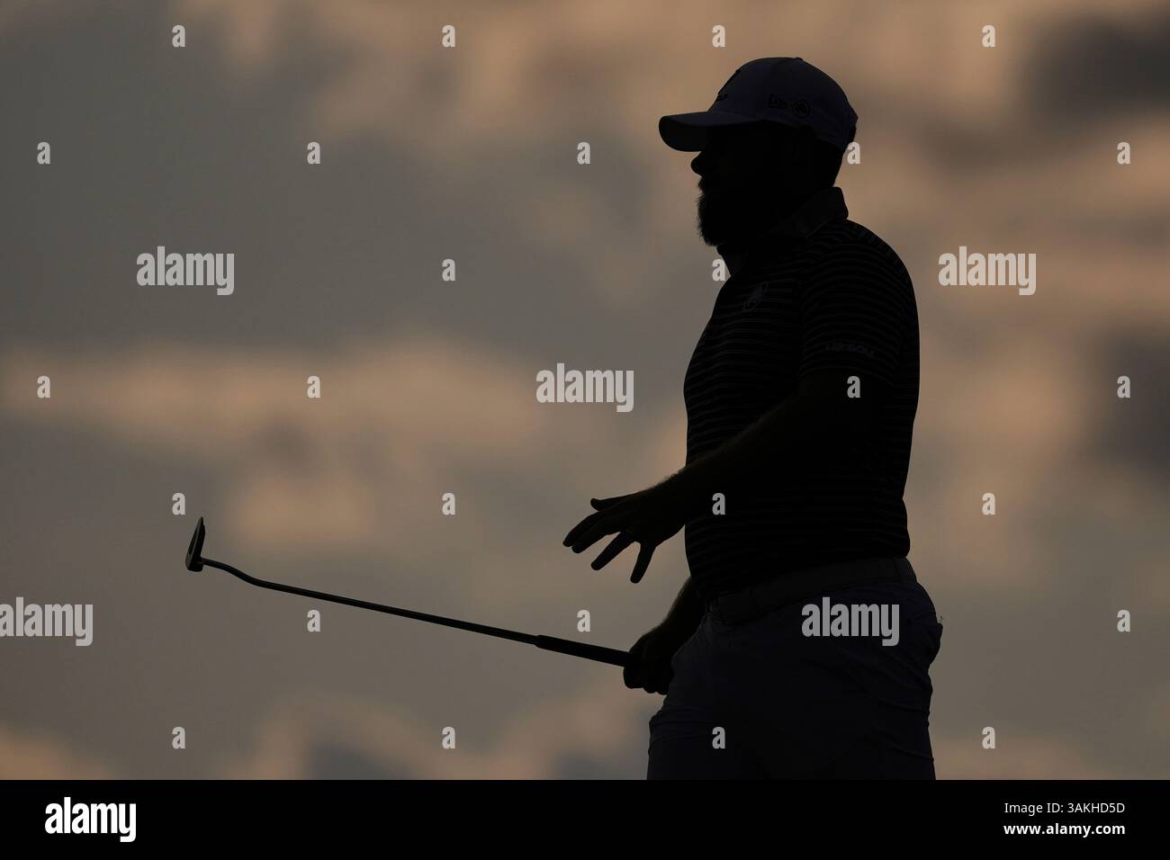 Tyrrell Hatton, of England, reacts after missing a putt on the 17th ...