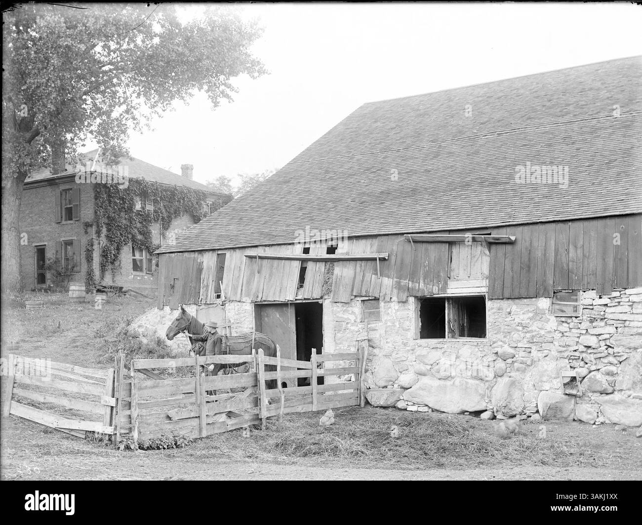 The Gideon Pond House and Barn, featuring a man with a harnessed horse ...