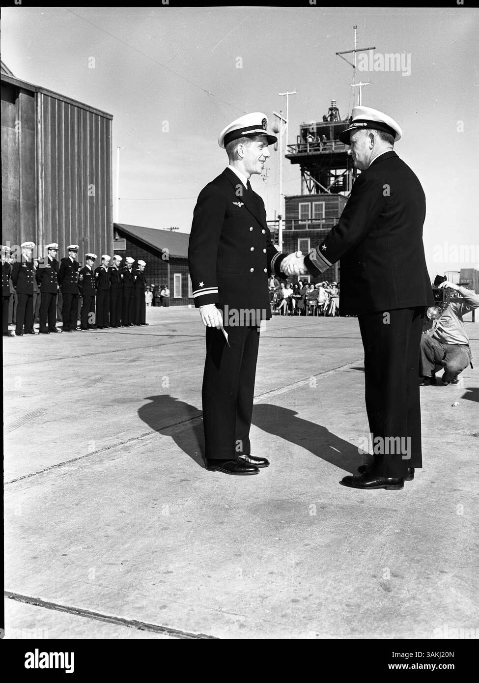 Lieutenant John H. Drew, a Navy officer from Cloquet, is presented with ...