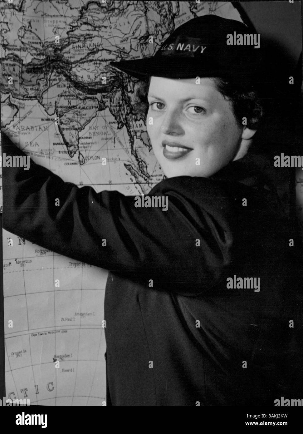 Alice Lorraine Koprules, a WAVE Apprentice Seaman, points to a map of ...