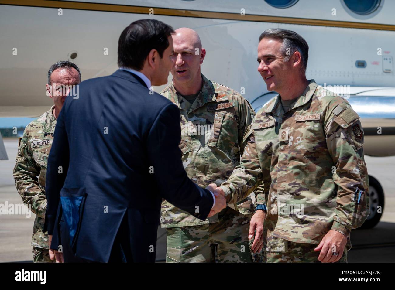U.S. Secretary of State Marco Rubio is greeted by U.S. Air Force Chief ...