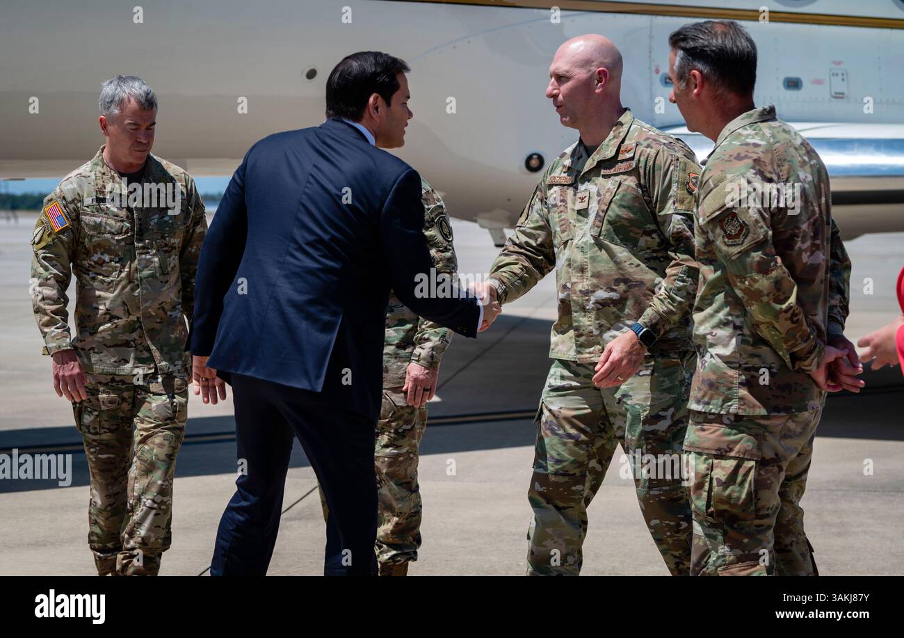 U.S. Secretary of State Marco Rubio is greeted by U.S. Air Force Col ...